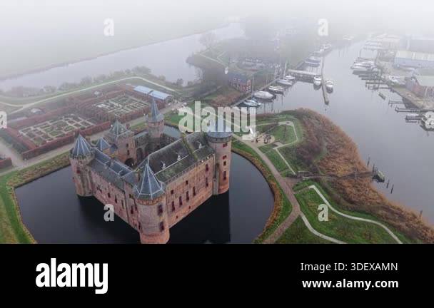 Aerial view of Muiderslot Castle moated medieval fortress with conical ...