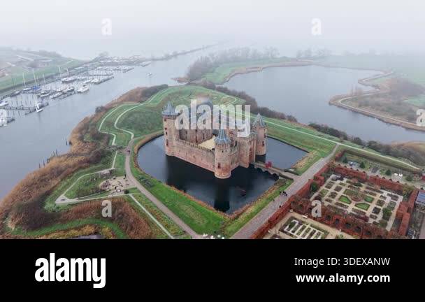 Aerial view of Muiderslot Castle moated medieval fortress with conical ...