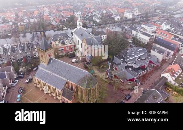 Aerial view of Dutch town gothic church with bell tower, white chapel ...