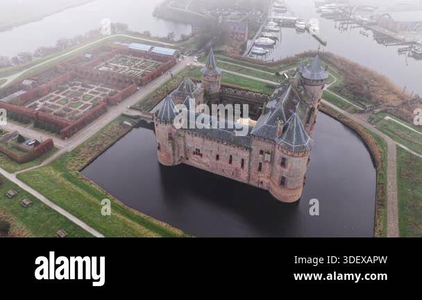 Aerial view of Muiderslot Castle moated medieval fortress with conical ...