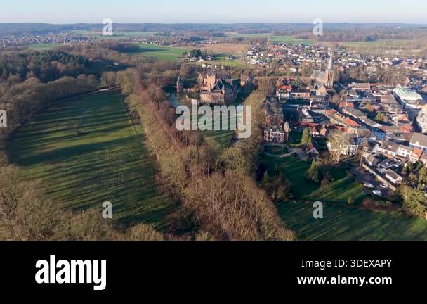 Aerial view of Dutch countryside town moated castle, church steeple ...