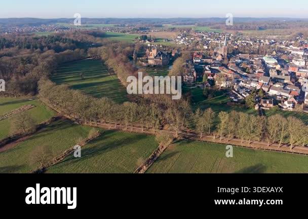 Aerial view of Dutch countryside town moated castle, church steeple ...