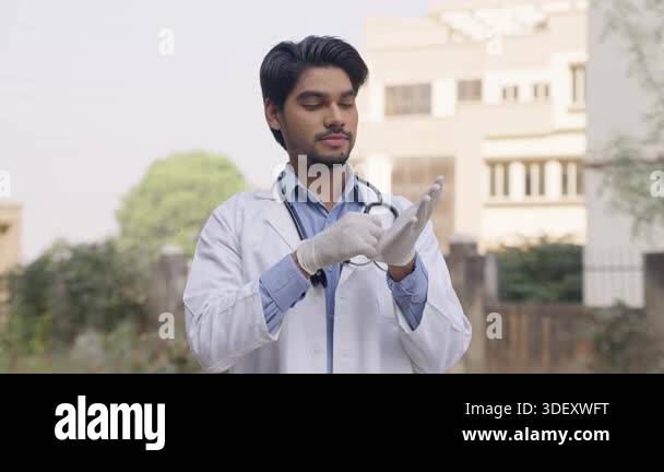 Indian Doctor Removing Surgical Gloves and Showing Thumbs Up Stock ...