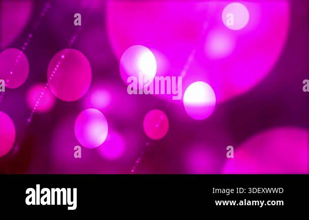 Experience the dynamic energy of vibrant pink bokeh lights in motion ...