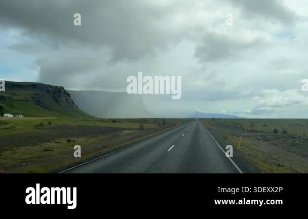 Endless Asphalt Road Vanishing into Dramatic Cloudy Sky in Iceland ...
