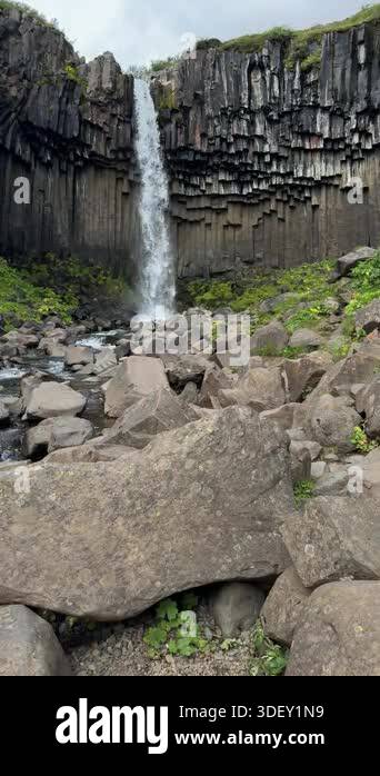 Majestic Waterfall on Basalt Cliff with Green Moss in Icelandic ...
