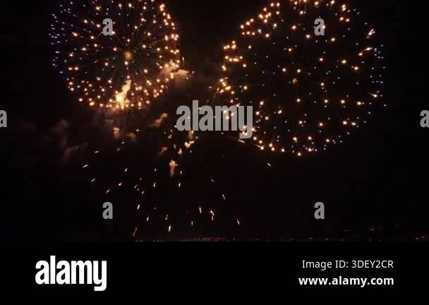 fireworks explode over the river Stock Video Footage - Alamy