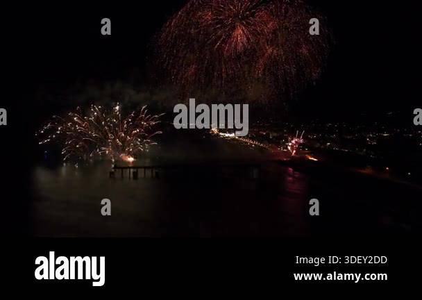 fireworks explode over the river Stock Video Footage - Alamy