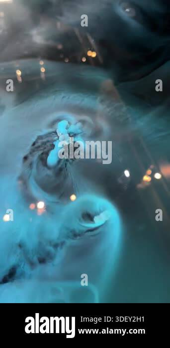 Blue Ink Vortex Swirling In Water Under Teal Light Luminous Dye Forms ...