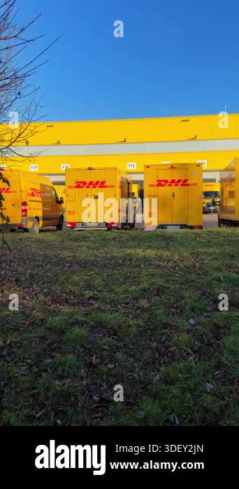 Yellow electric delivery vehicles of the German postal service are ...