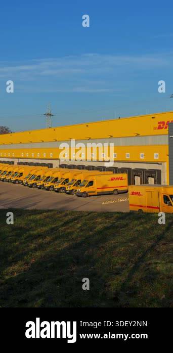 Yellow electric delivery vehicles of the German postal service are ...