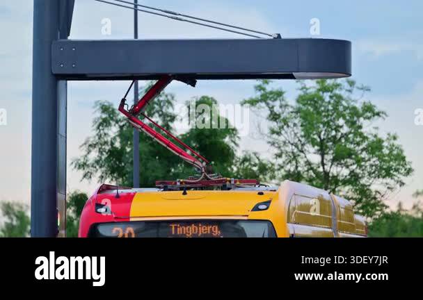 Copenhagen, Denmark - August 2, 2025: Electric bus receiving power from ...