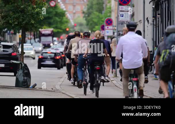 Copenhagen, Denmark - August 5, 2025: Cyclists riding bikes on a city ...