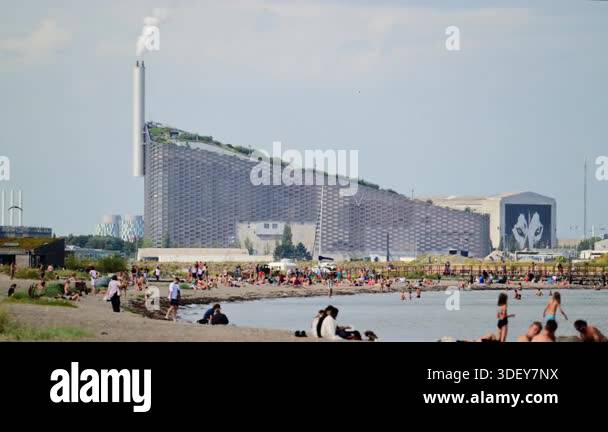 Copenhagen, Denmark - August 4, 2025: People enjoying a beach with the ...