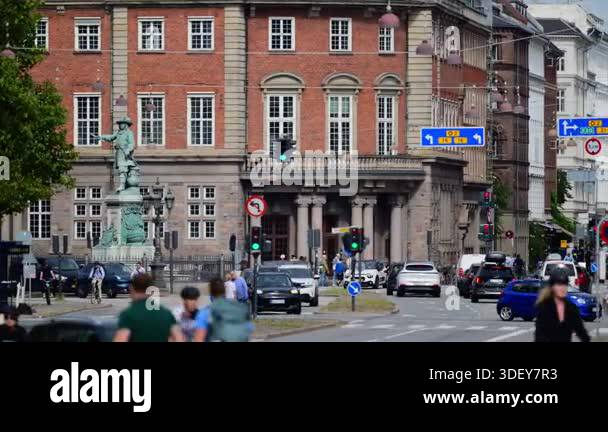Copenhagen, Denmark - August 4, 2025: Niels Juel statue overseeing busy ...