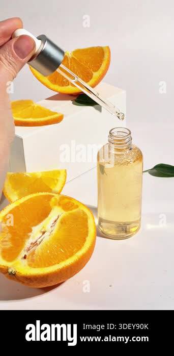 Vitamin C Serum Dropper Bottle with Fresh Oranges for Skincare Stock ...
