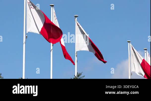 Malta flags against a blue sky. Traveling through Europe Stock Video ...