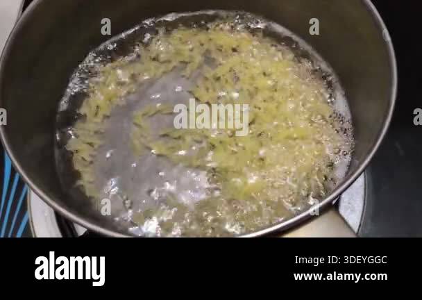 Boiling Fusilli Pasta in Hot Water with Bubbles Stock Video Footage - Alamy