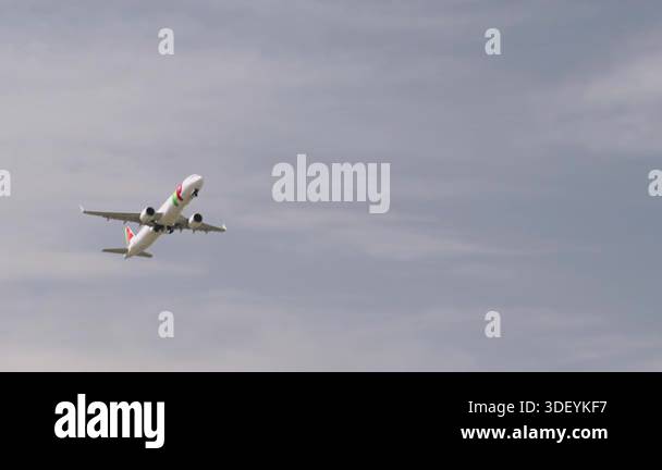 TAP Air Portugal airplane ascending through sky during takeoff ...