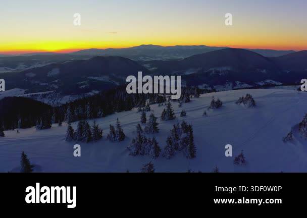 The extraordinary Carpathian valley with snow-capped hills and ...