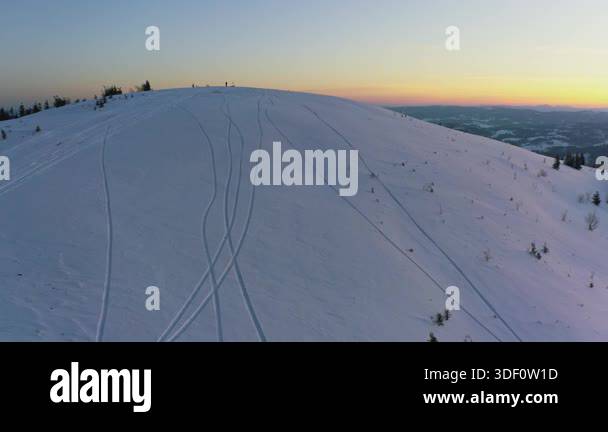 The extraordinary Carpathian valley with snow-capped hills and ...
