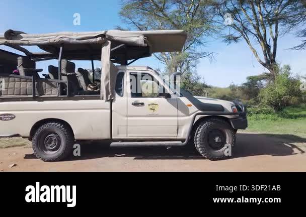 Side view of open safari truck in Masai Mara sunlight Stock Video ...