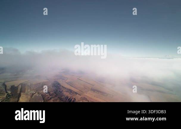 Top view of cloudscape shot during daytime, first person view. Very ...