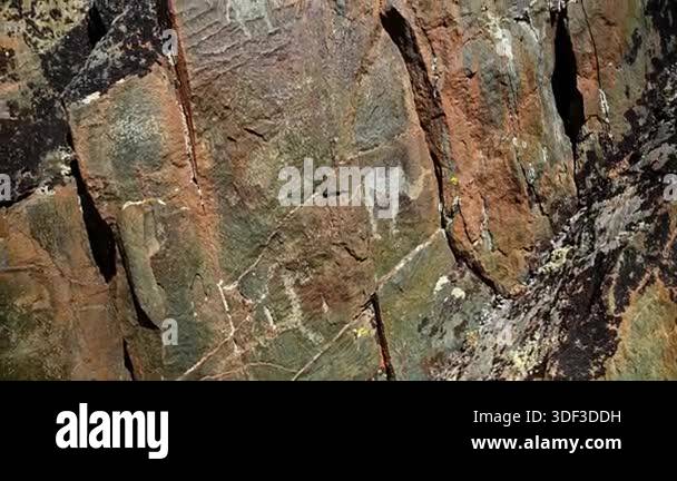Images engraved on stone by ancient inhabitants of Central Asia in the ...