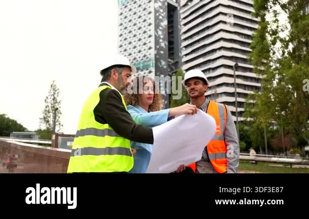 Diverse group of construction engineers and an architect woman ...