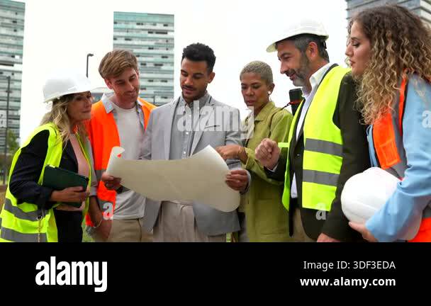 Professional group of multicultural engineers and executives discussing ...