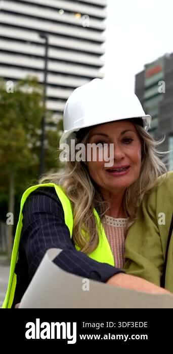 Diverse group of professional engineers and architects discussing a new ...