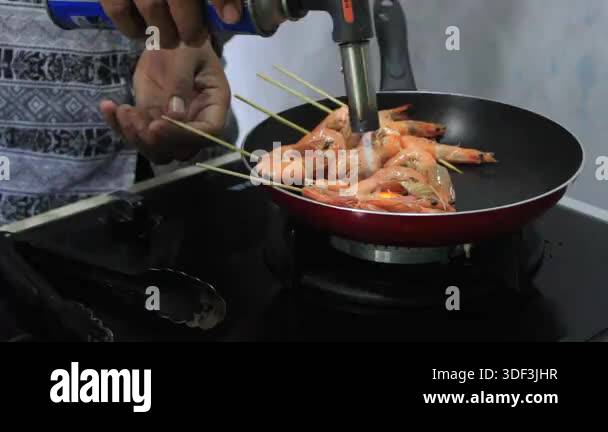 Chef Using a Torch to Grill Shrimp Skewers Stock Video Footage - Alamy