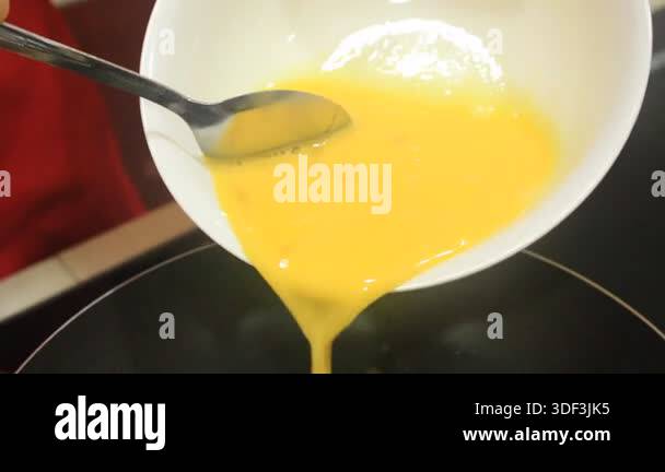 Someone fried a beaten egg. Cooking fried eggs Stock Video Footage - Alamy