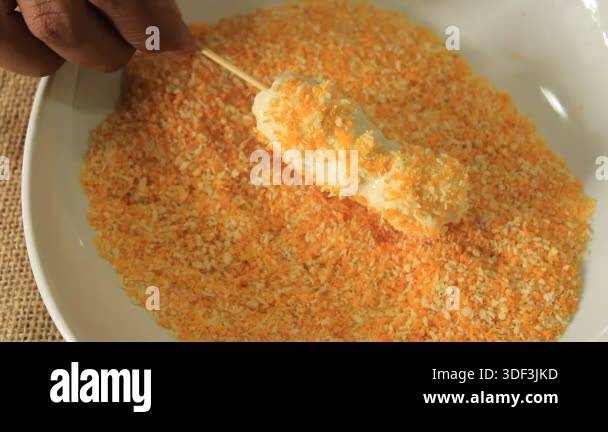 Close Up Of Coating Mini Corndog With Breadcrumbs For Deep Frying Stock ...