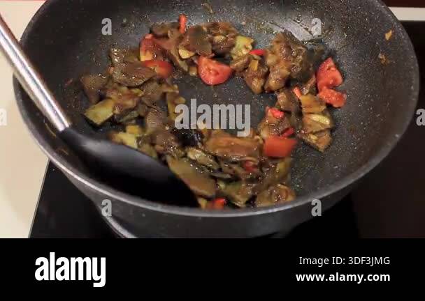 stir fry beef in a pan Stock Video Footage - Alamy