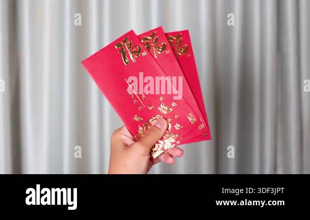 Red Envelope in Hand holding, Angpao Envelope with Golden Chinese ...