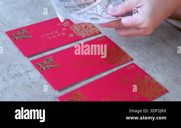 Giving Red Envelopes angpao with Thai Banknotes for Lunar New Year ...