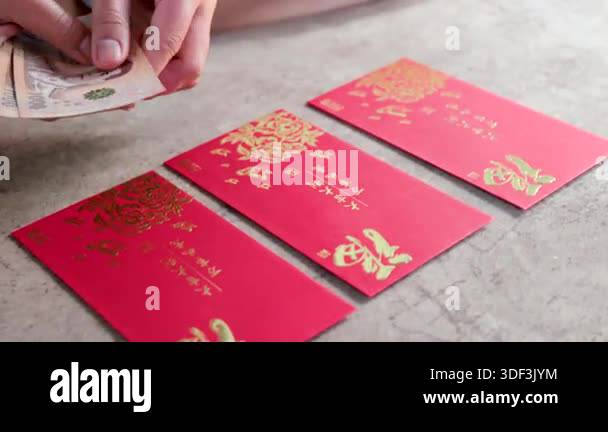 Giving Red Envelopes angpao with Thai Banknotes for Lunar New Year ...