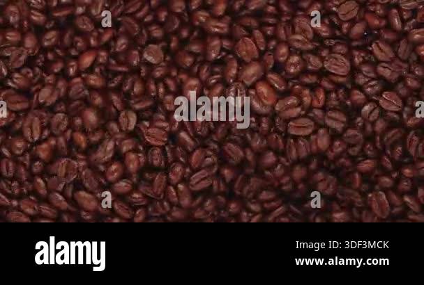 Roasting coffee beans takes place early in the day at a local shop. The ...