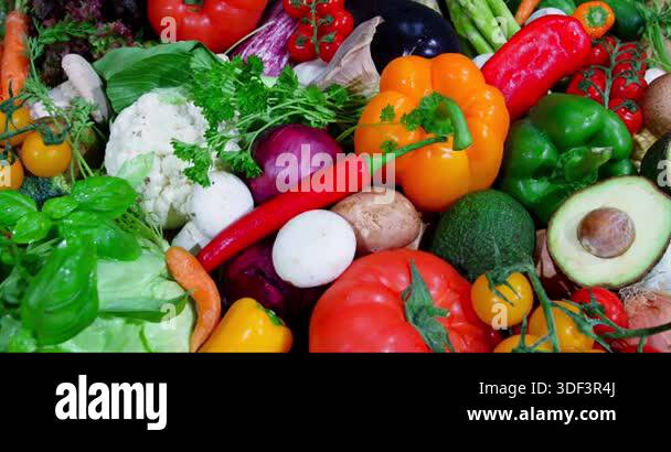 A variety of fresh vegetables are displayed, showing colors and shapes ...