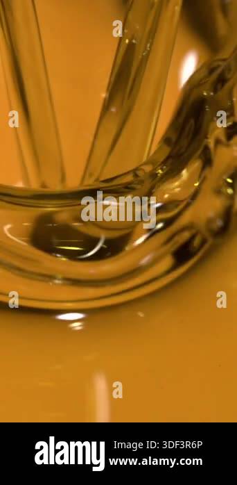 Super Slow Motion Golden Olive Oil Pouring Over Surface, CloseUp Macro ...