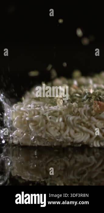 Super Slow Motion Dry Ramen Block With Falling Seasoning Captured In ...