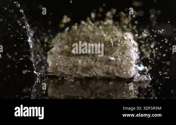 Super Slow Motion Instant Noodle Block Drenched In Splash HighSpeed ...
