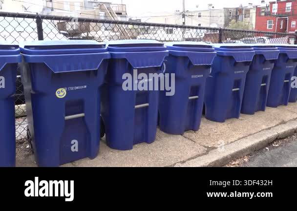Baltimore, Maryland USA Rows of garbage cans on a residential street in ...