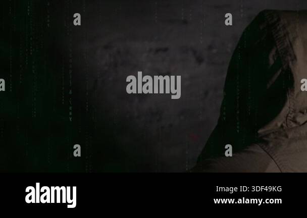 Anonymous hooded hacker with back to camera during police interrogation ...