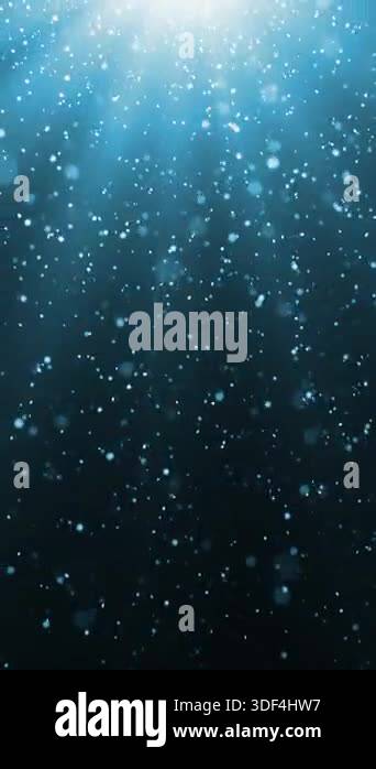 Christmas Snow Falling in Light Rays, Warm Cinematic Background. Smooth ...