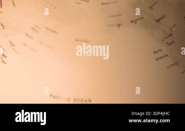 Pacific Ocean on small tabletop globe with focus shift from blur to ...