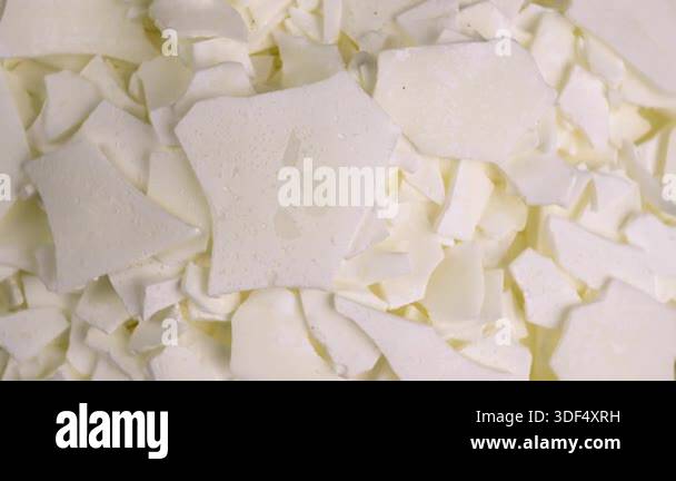 Top view of rotating dry soy textured wax flakes, highlighting plant ...