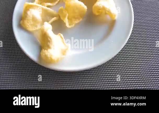 Asian Thai crab chips snack served on a white plate in Patong Beach ...