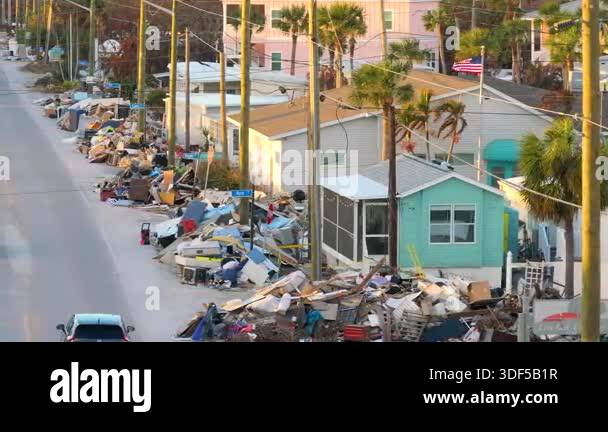 Rubbish and scrap disposed in heaps on street side after hurricane ...